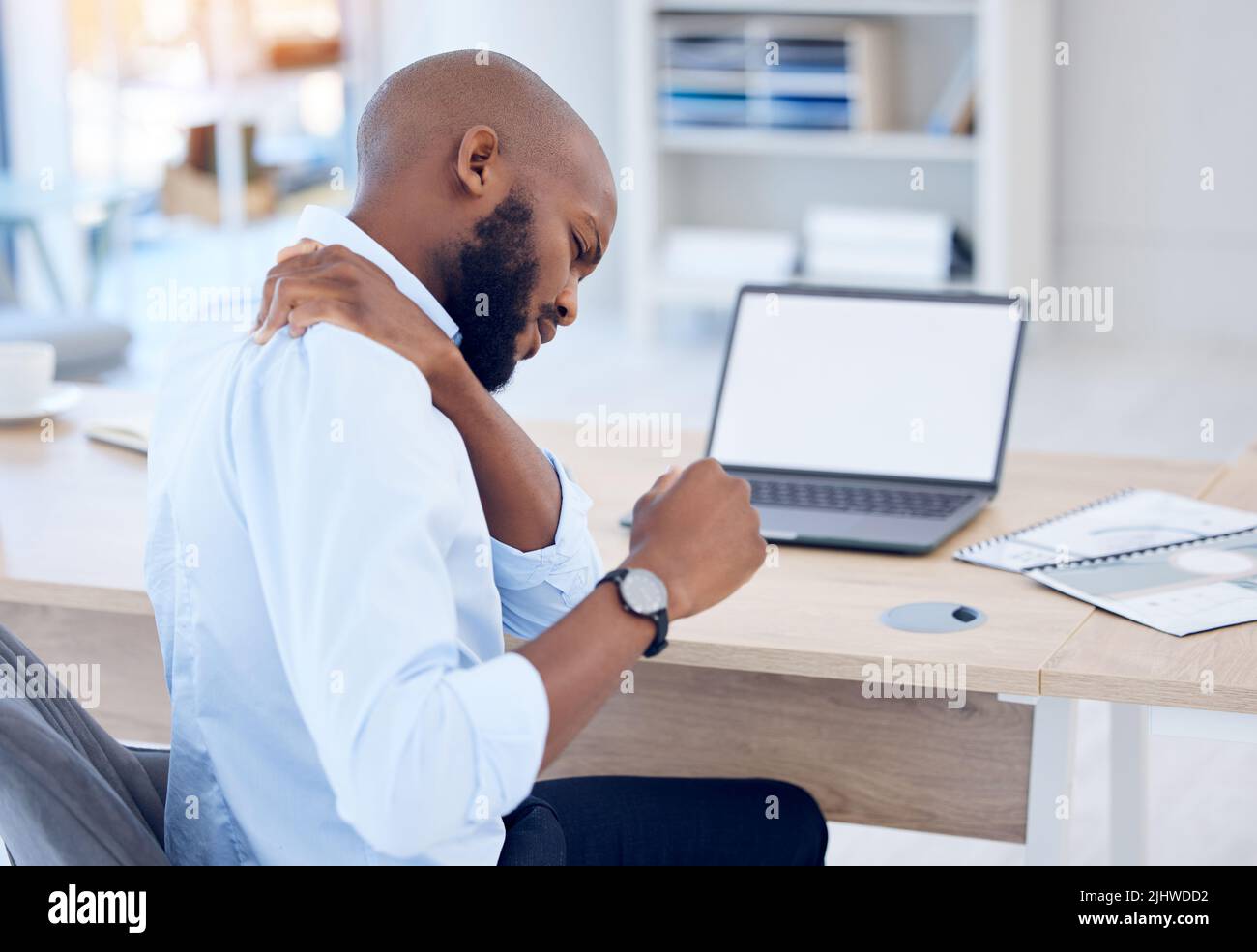 The tensions building up. a young businessman suffering from back pain ...