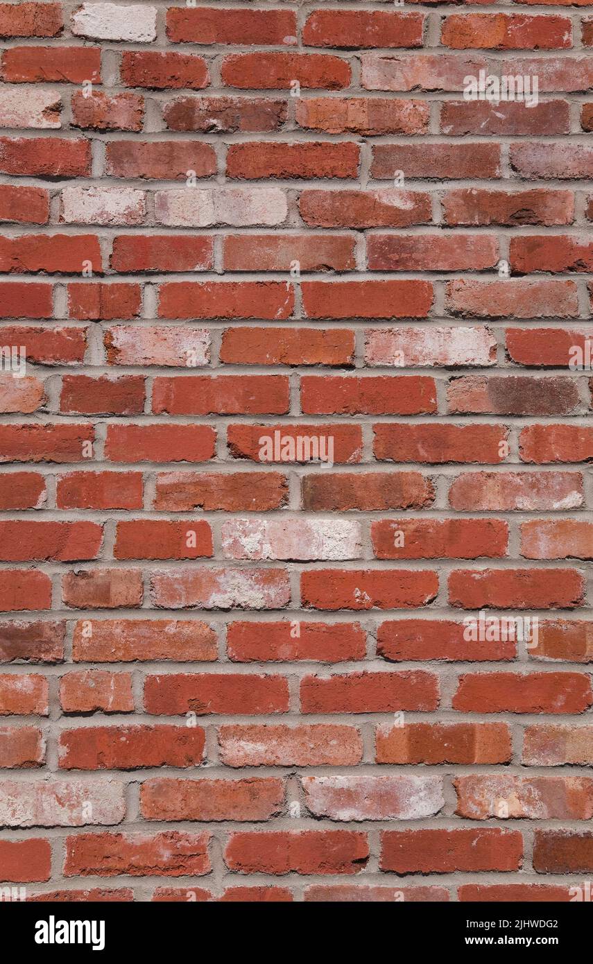 Close-up of a uneven colored brick wall Stock Photo - Alamy