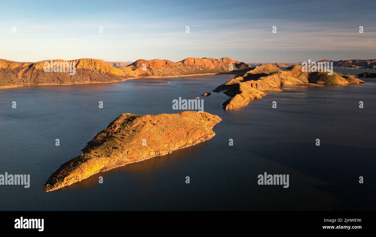 A crocodile looking rock with beautiful sunset in Lake Argyle ...
