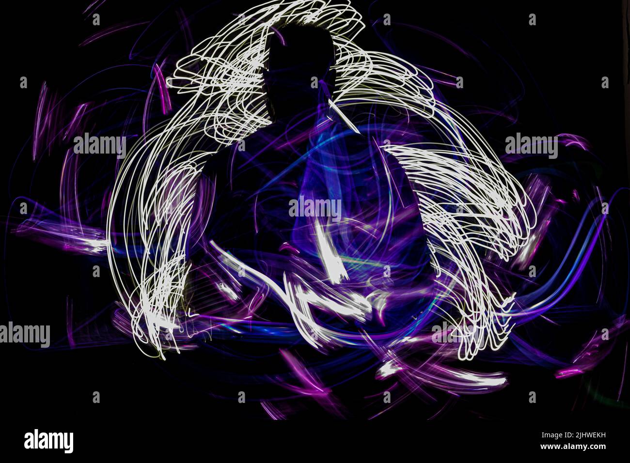 light painting photography with long exposure. abstract art made with ...