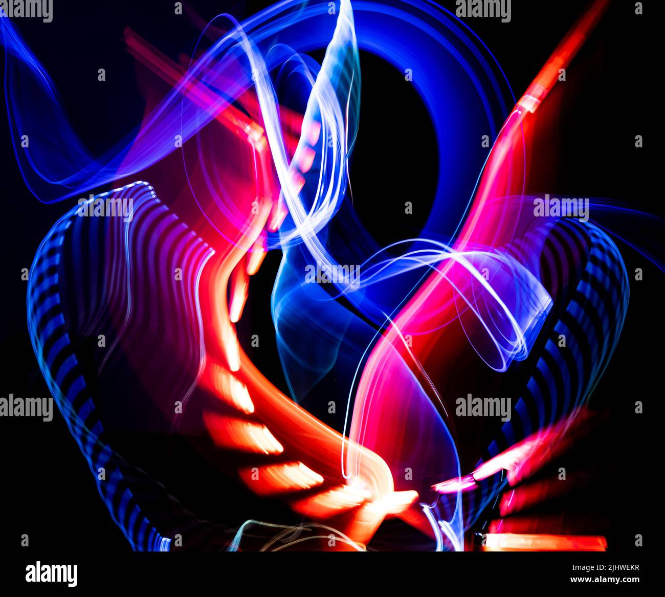 light painting photography with long exposure. abstract art made with ...