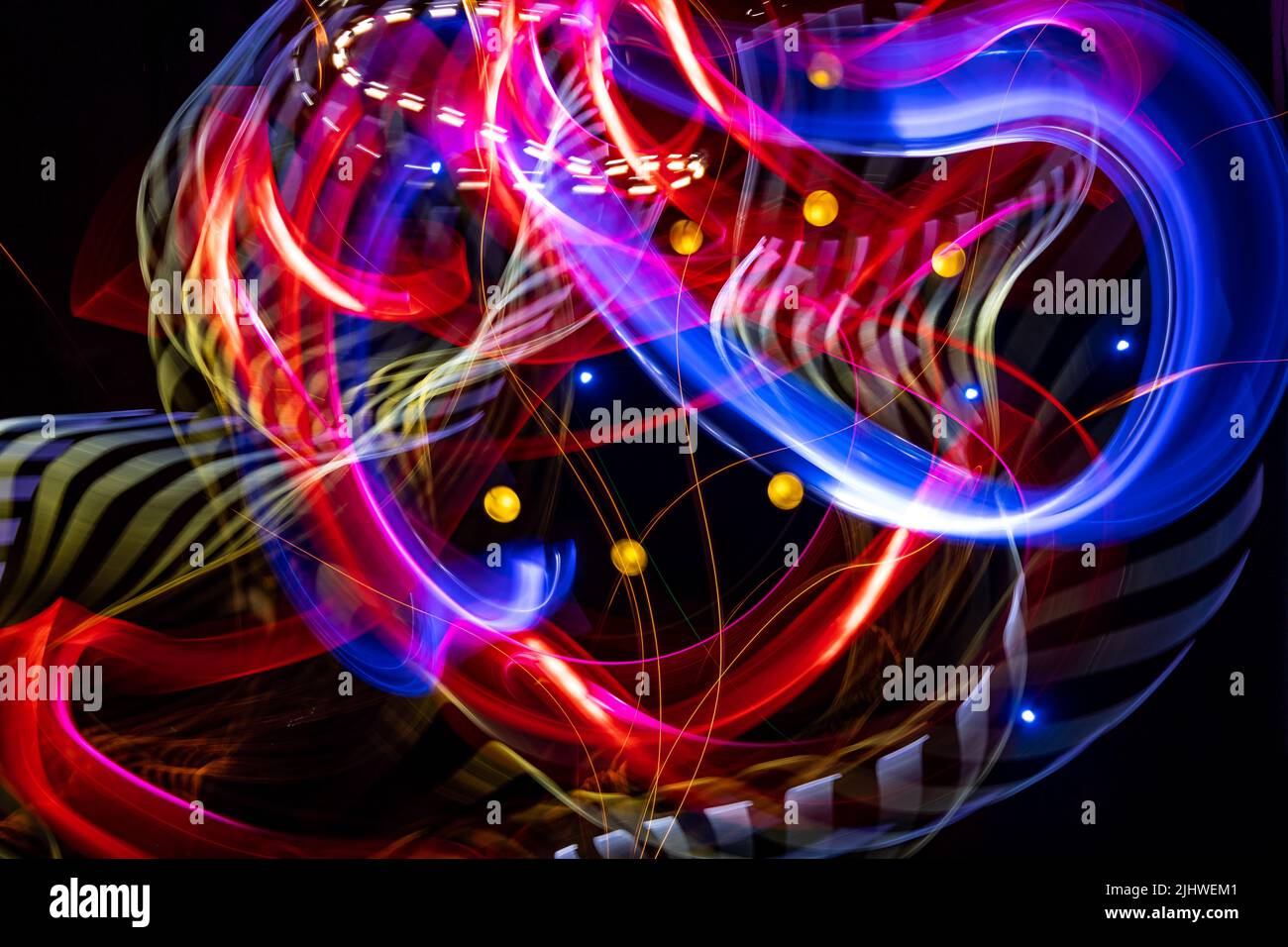 light painting photography with long exposure. abstract art made with ...