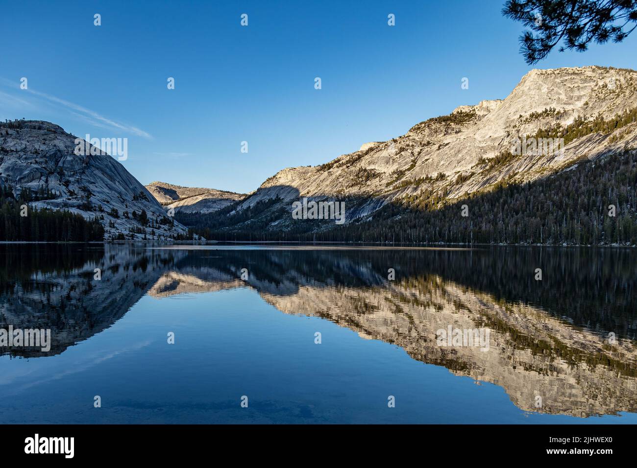 Mountains range with reflection on a lake during sunset. Mirror lake ...