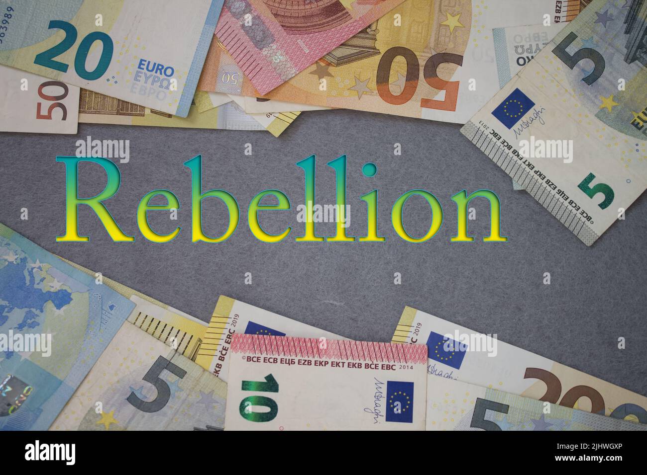 Rebellion word with money. Paper currency background with different ...