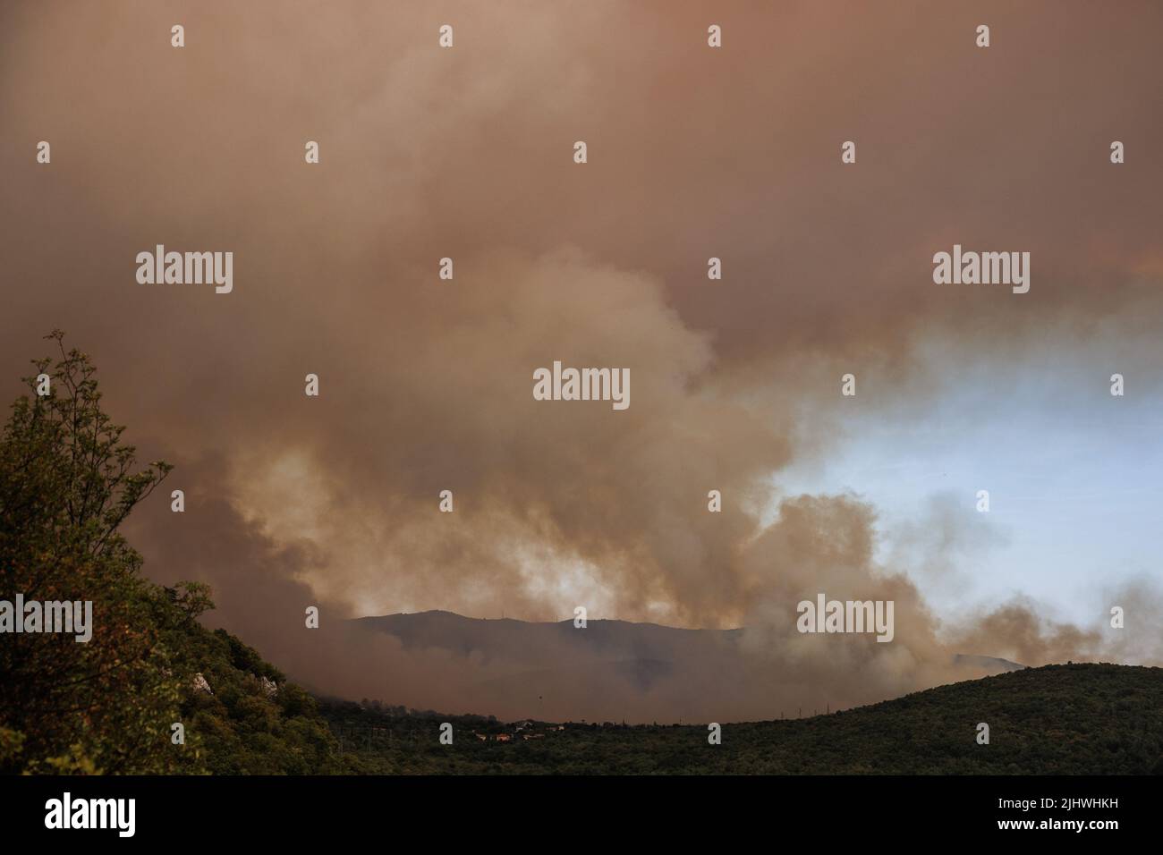 Jamiano, Italy. 20th July, 2022. A large wildfire rages in the village ...