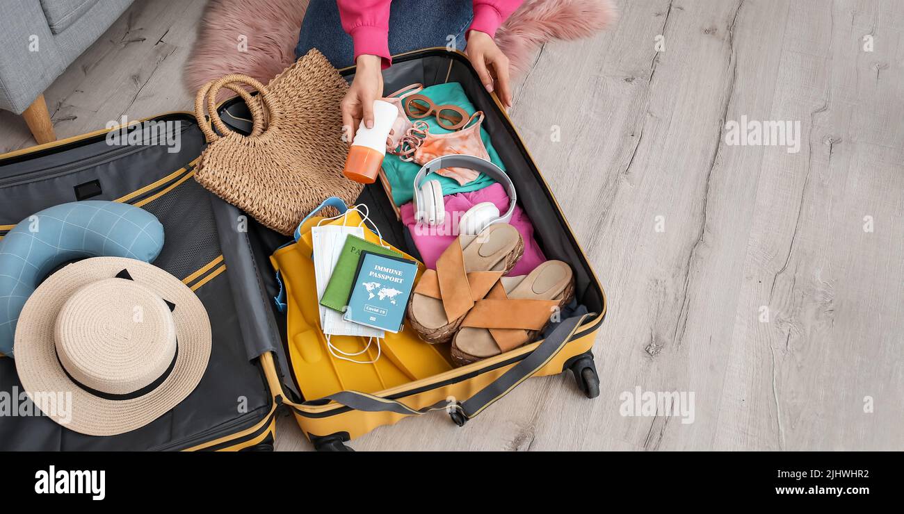 Woman packing suitcase at home. Banner for design Stock Photo - Alamy