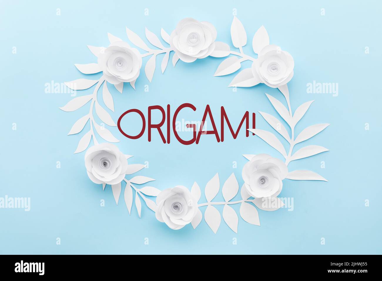 Beautiful handmade paper flowers, leaves and word ORIGAMI on blue ...