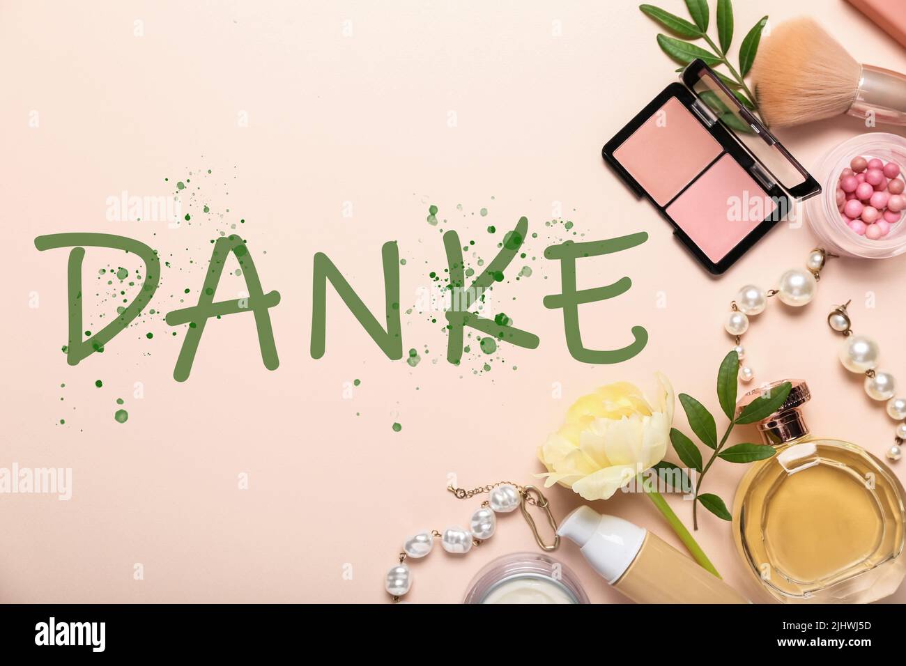 Decorative cosmetics, jewellery, flower and word DANKE (German for ...
