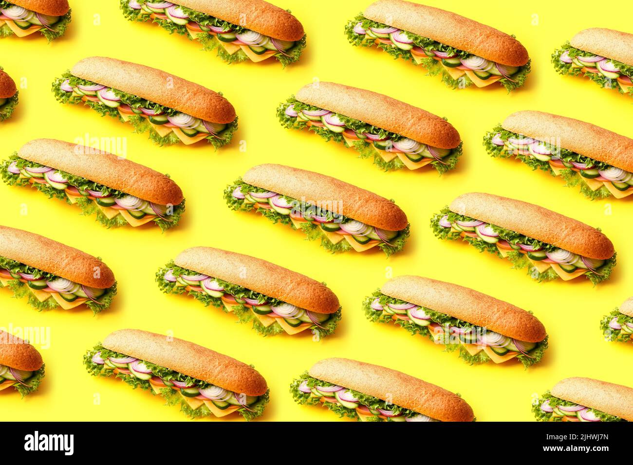 Many tasty sandwiches on yellow background. Pattern for design Stock ...