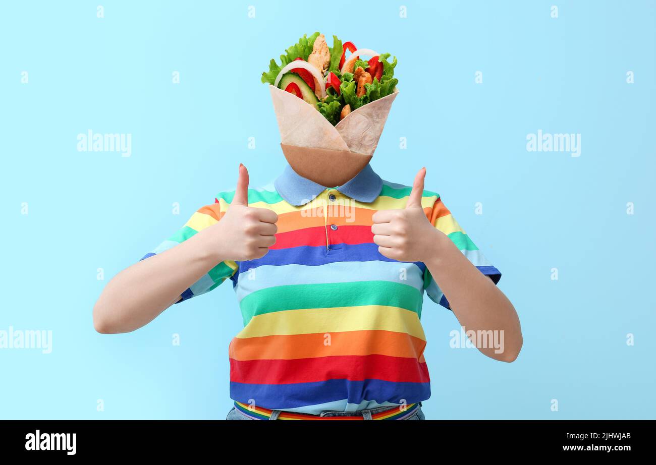 Young woman with tasty doner kebab instead of her head showing thumb-up ...