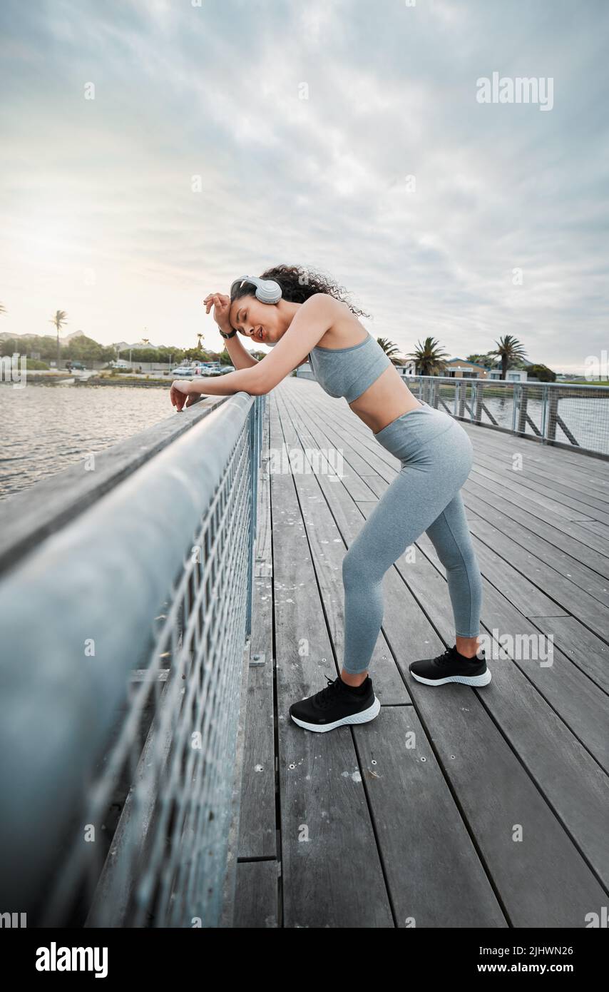 Putting her body through the ringer. Full length shot of an attractive young female athlete ...
