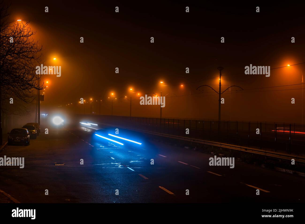 A night city in a dense fog Stock Photo - Alamy