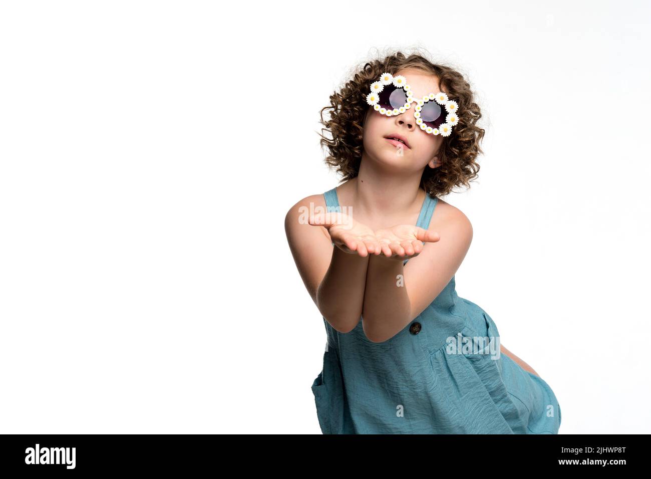Friendly curly short-haired girl 10-12s in blue summer sundress and ...