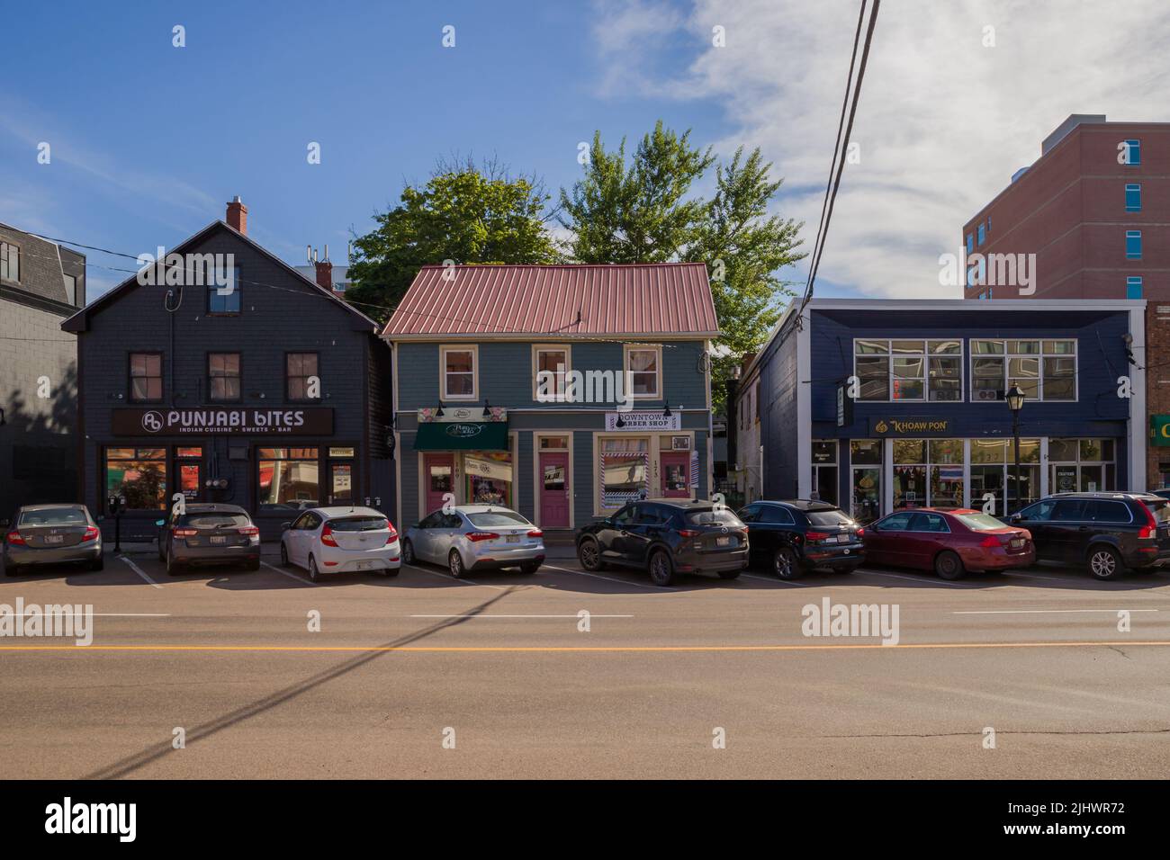 Old style shops outside with parking Stock Photo - Alamy