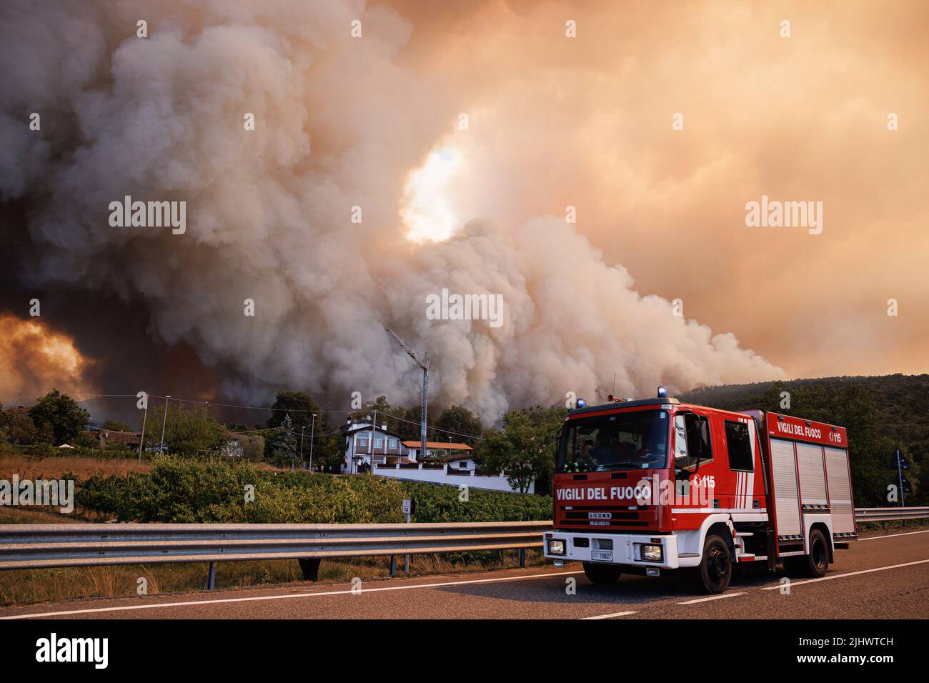 A large wildfire at the border of Miren and northeast Italy is seen ...