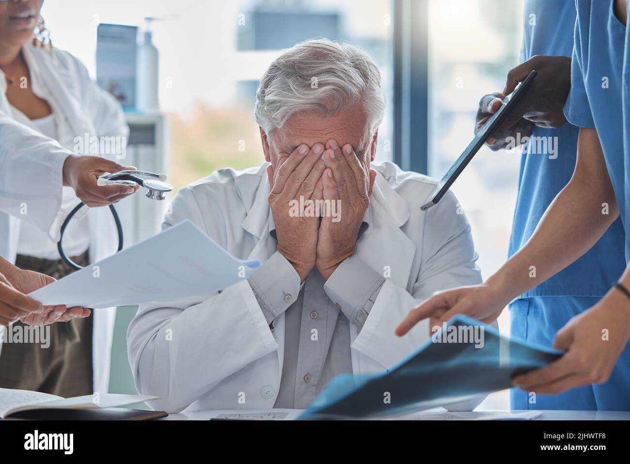 Theres a lot of pressure on the department head. a mature male doctor ...
