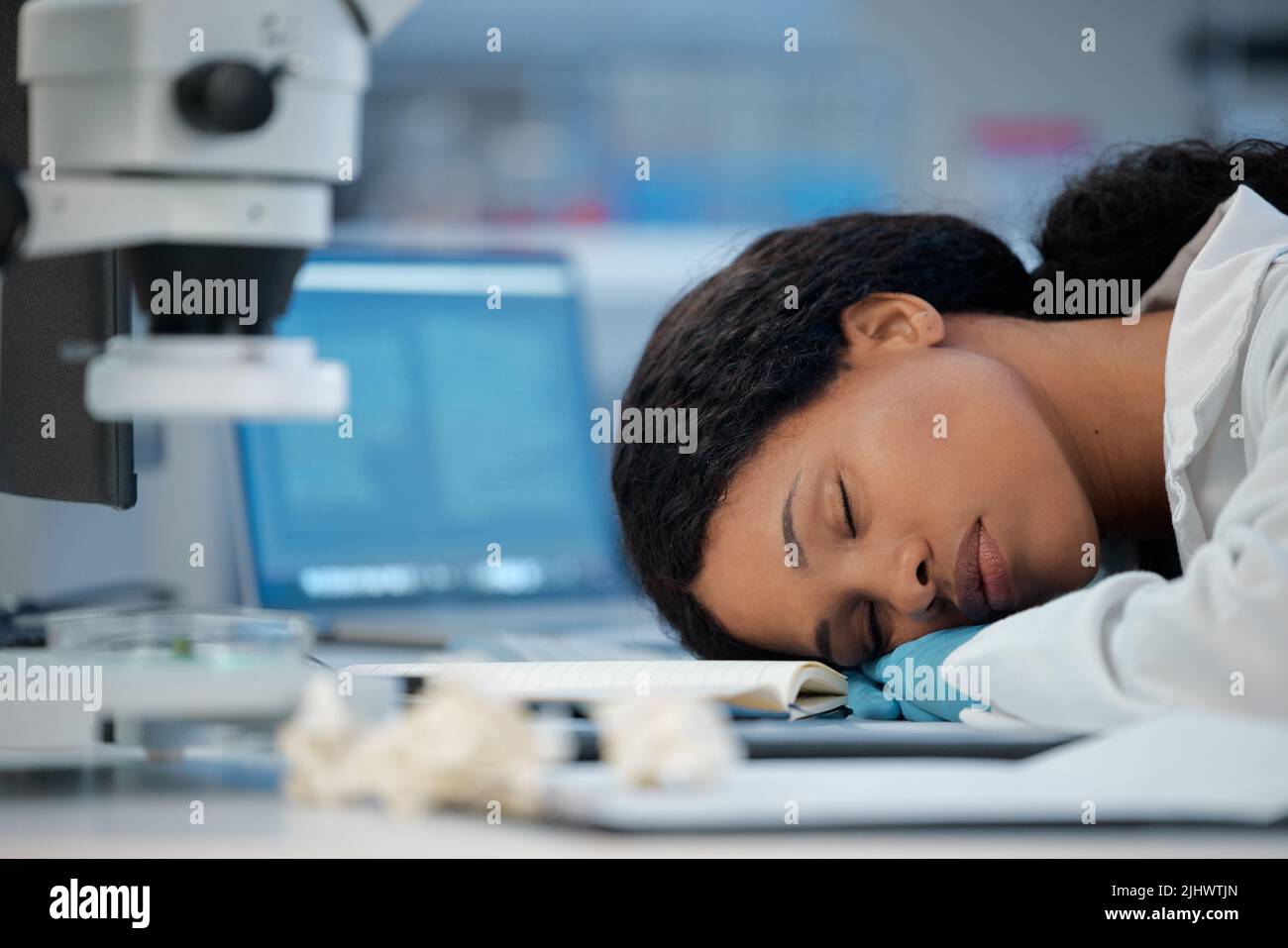 Just a quick disco nap. an exhausted lab tech taking a nap at work ...