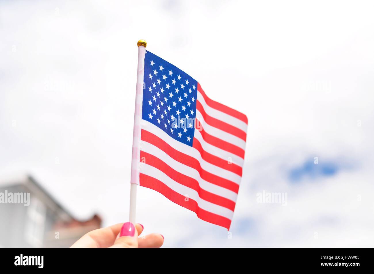 Close up of national flag of USA stripes and stars red and blue colors ...
