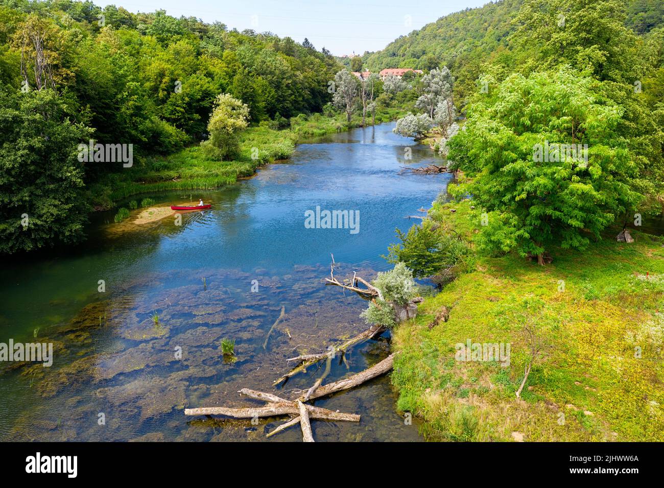 Tourists paddling in a canoe on a day excursion, exploring spectacular ...