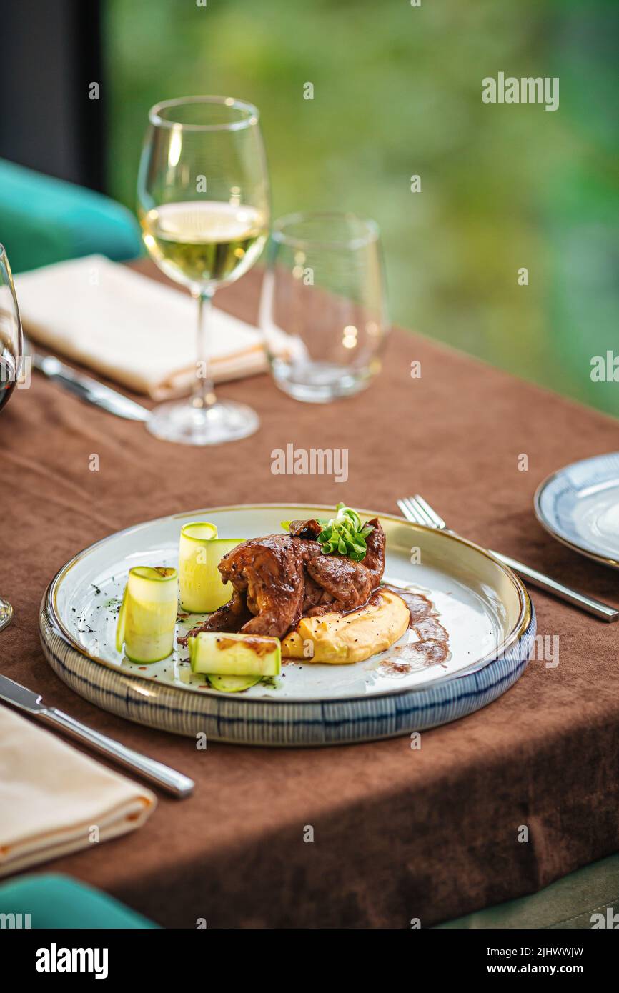 Gourmet quail dish with puree and red wine Stock Photo - Alamy