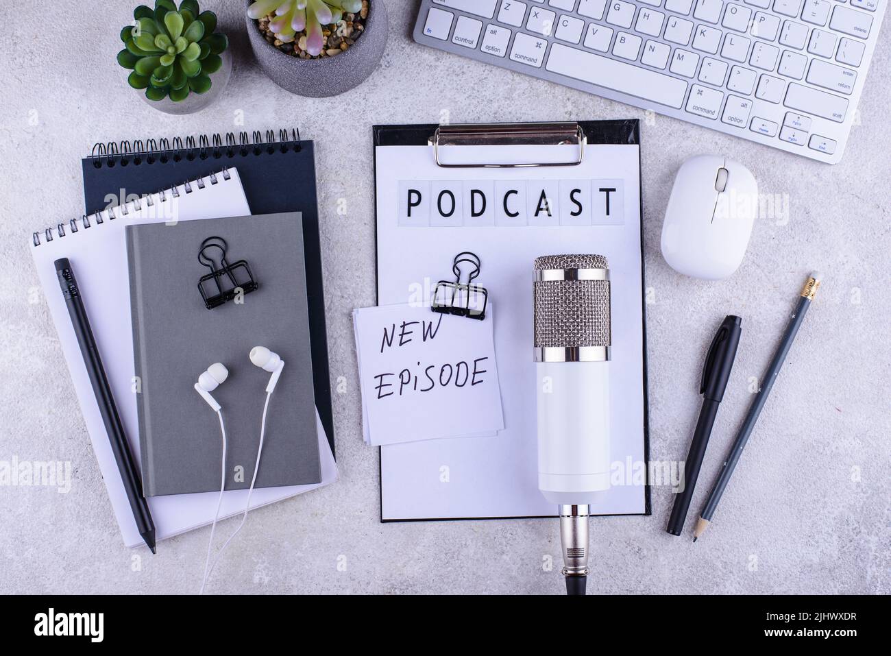 Podcast new episode concept with microphone Stock Photo - Alamy