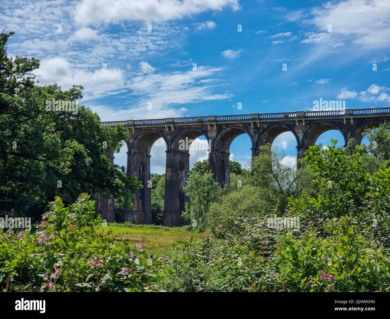 Summer countryside scene of the Balcombe viaduct in Sussex, England ...