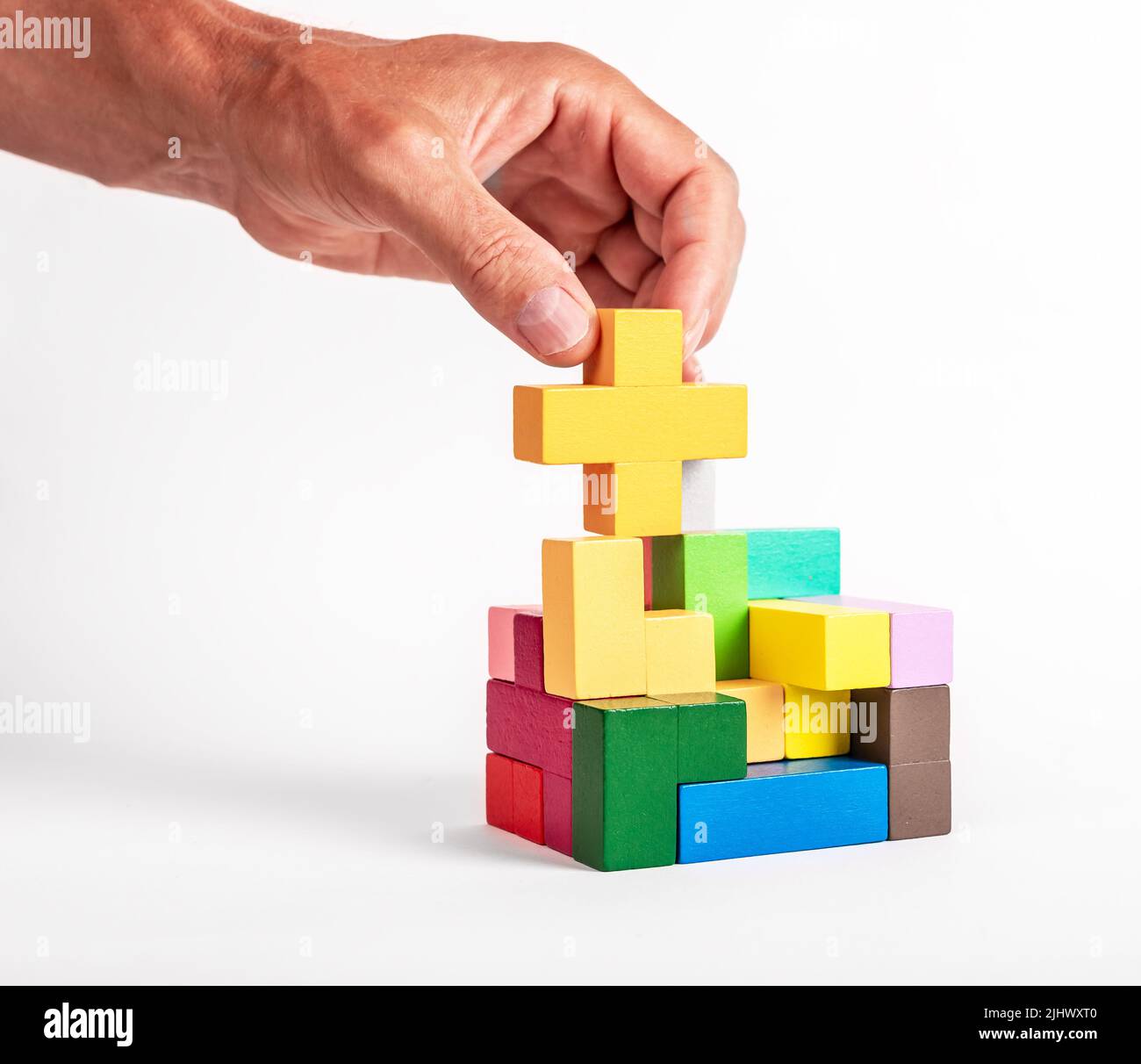 Man putting puzzle elements together in construction. Assembly ...