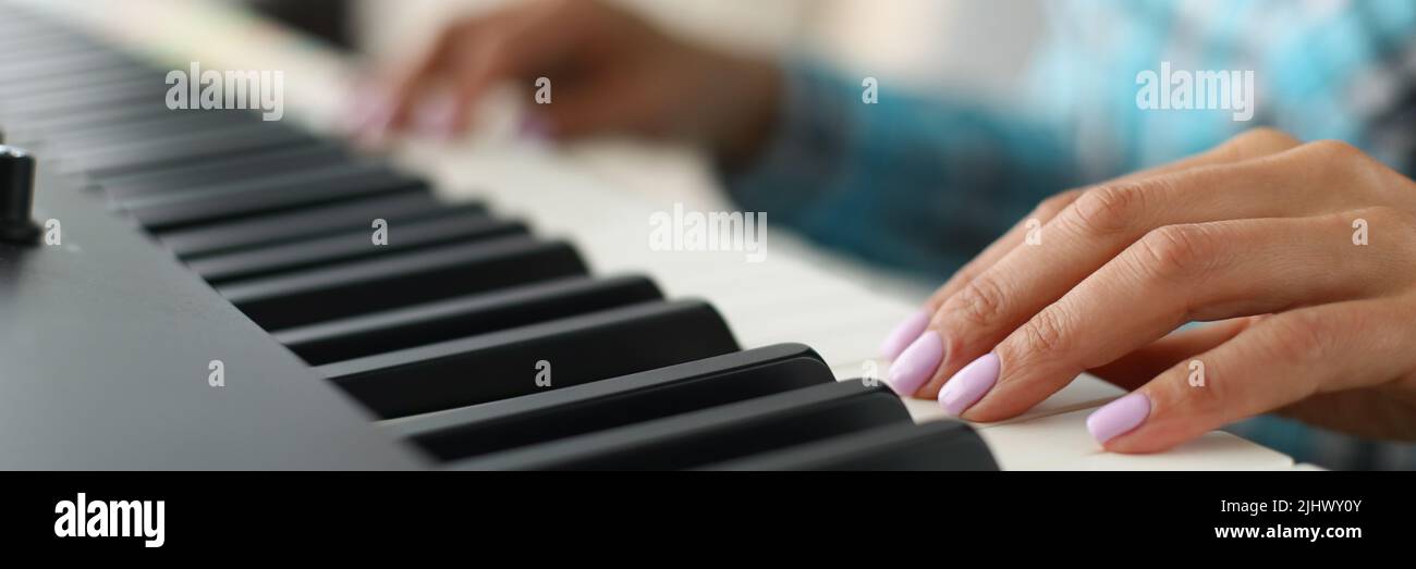 Womans hand touching white and black keyboards on piano Stock Photo - Alamy