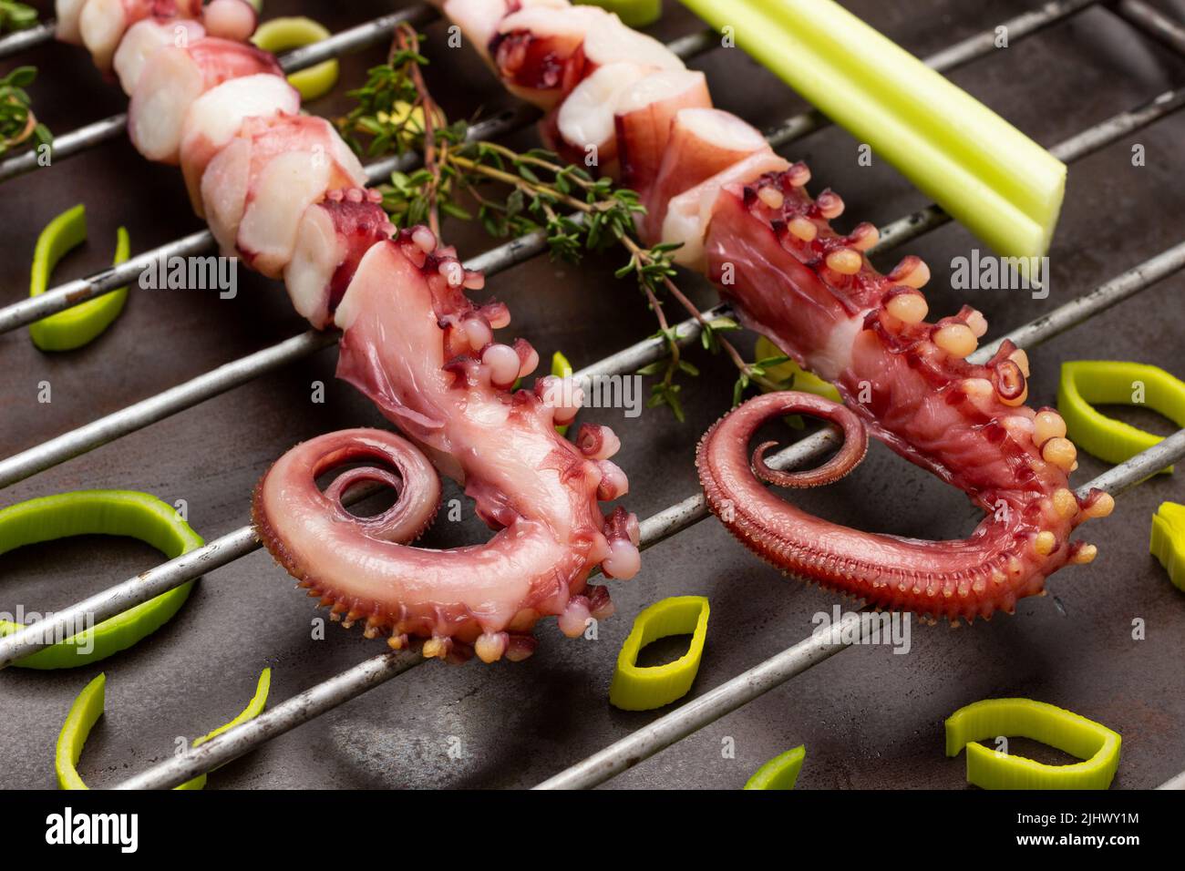 Grilled octopus tentacles. Rusty metal background. Top view Stock Photo ...