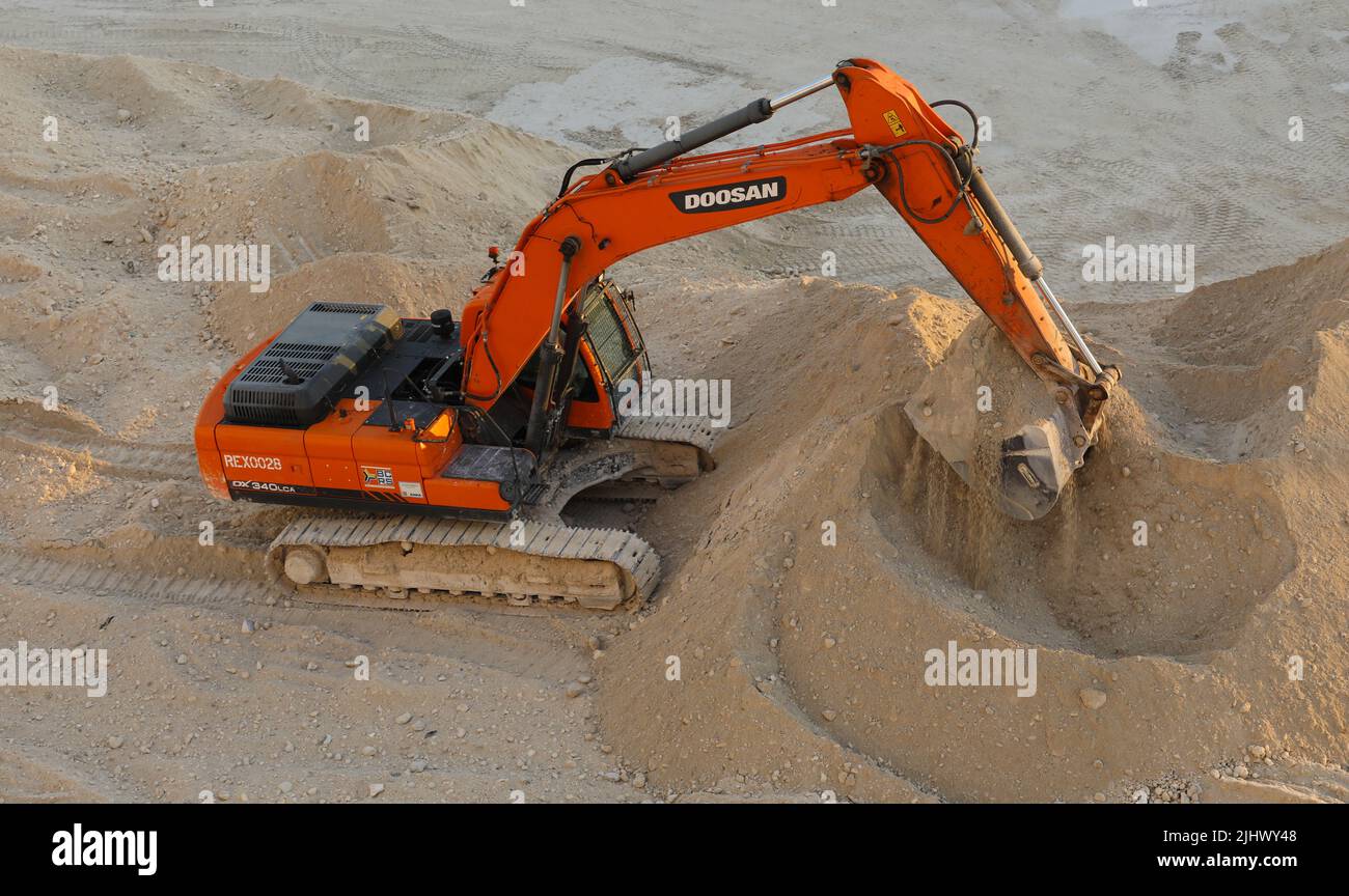 excavator machine at excavation earthmoving work in sand quarry Stock ...
