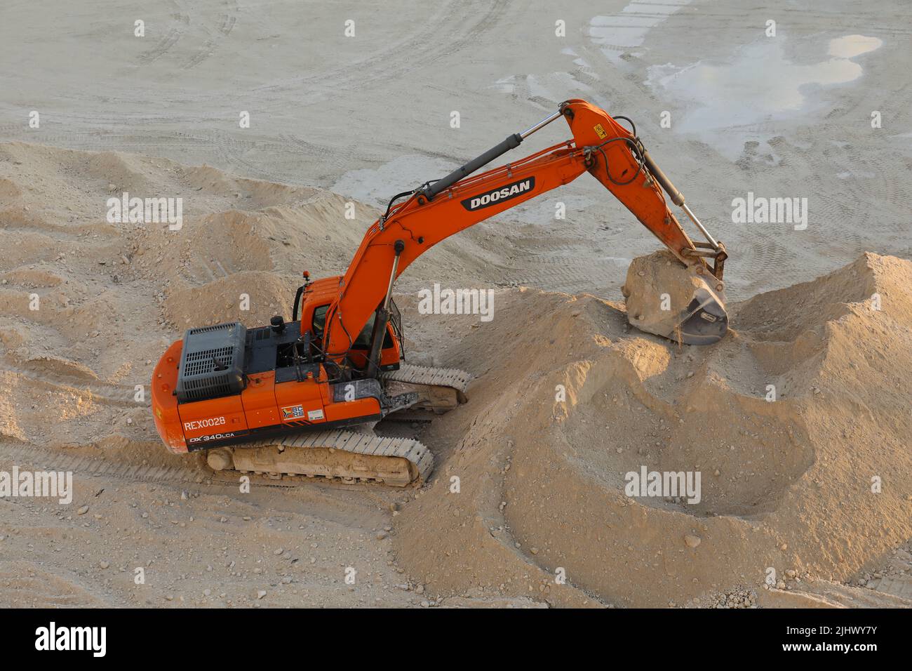 excavator machine at excavation earthmoving work in sand quarry Stock ...