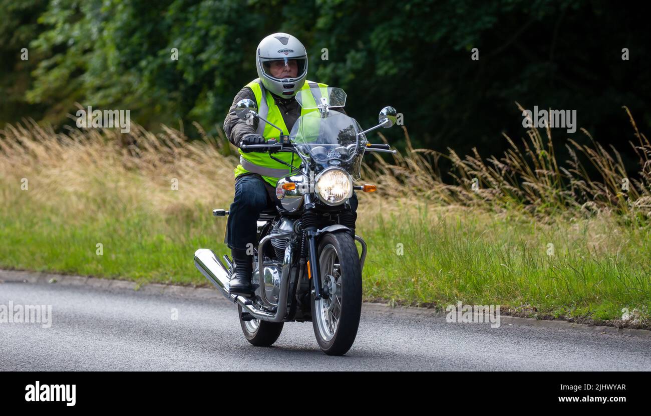 Man riding a Royal Enfield motorcycle Stock Photo - Alamy