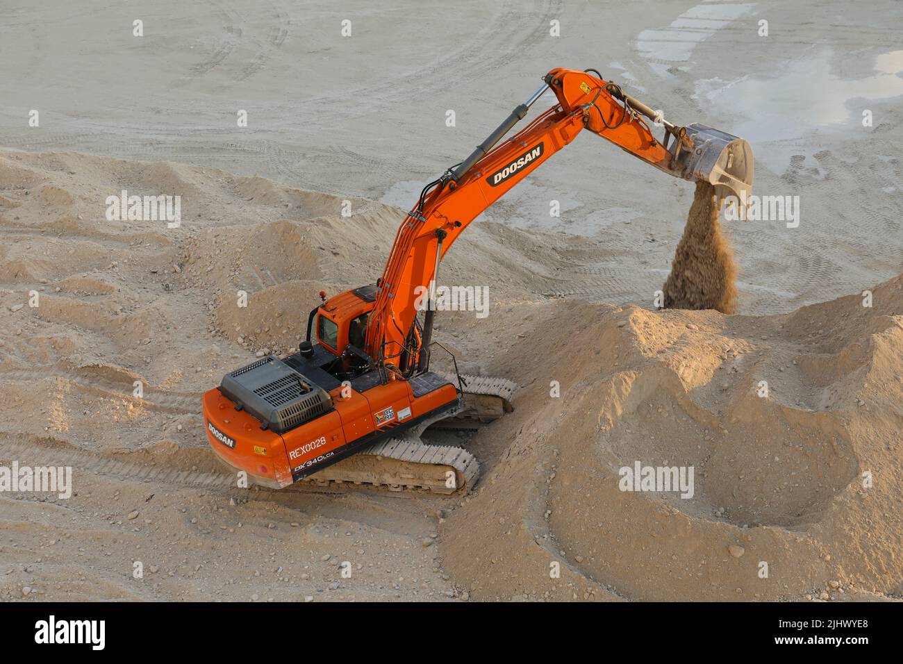 excavator machine at excavation earthmoving work in sand quarry Stock ...