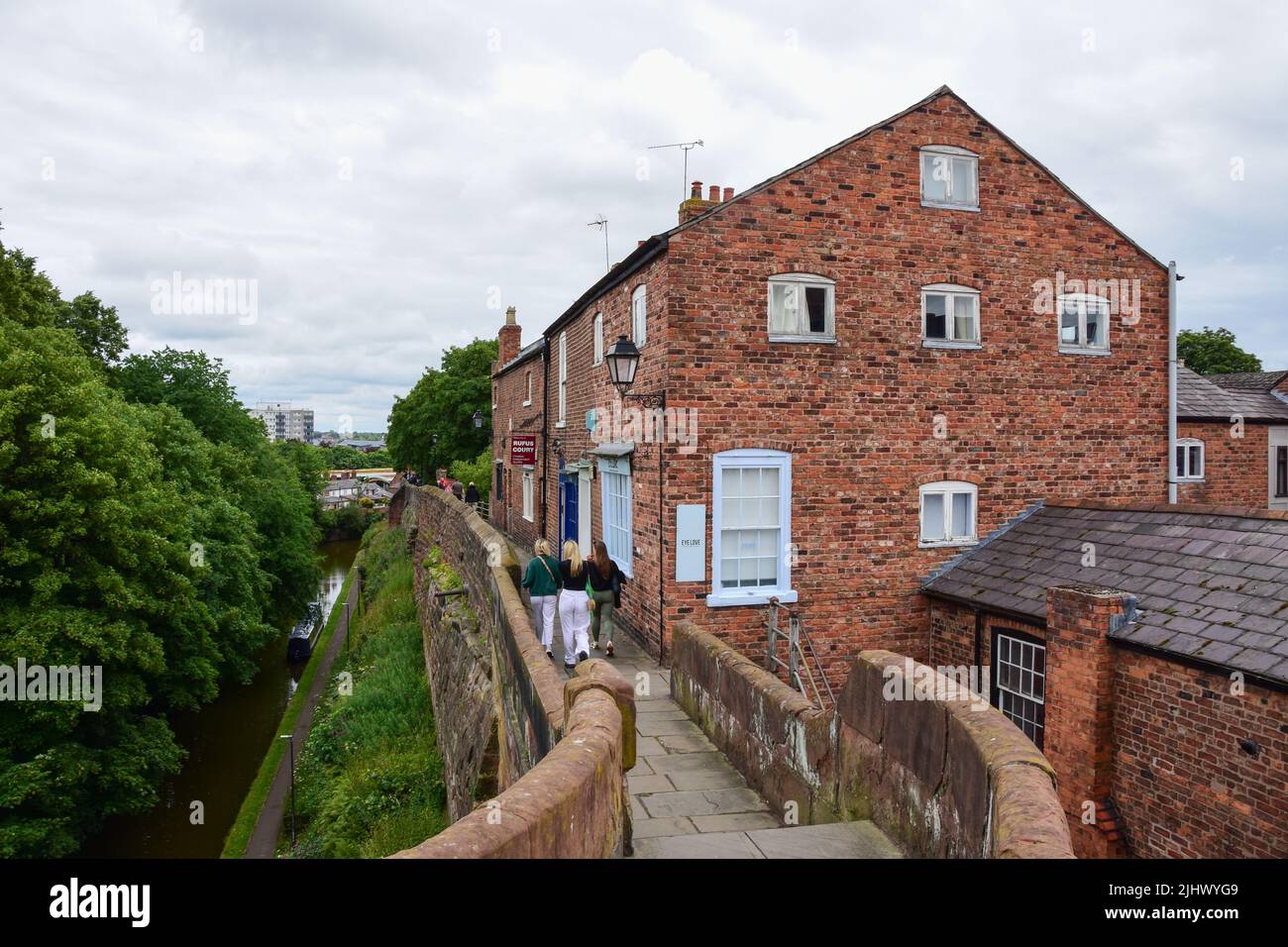Chester, UK; Jul 3, 2022; The Roman Chester City Walls with the canal ...