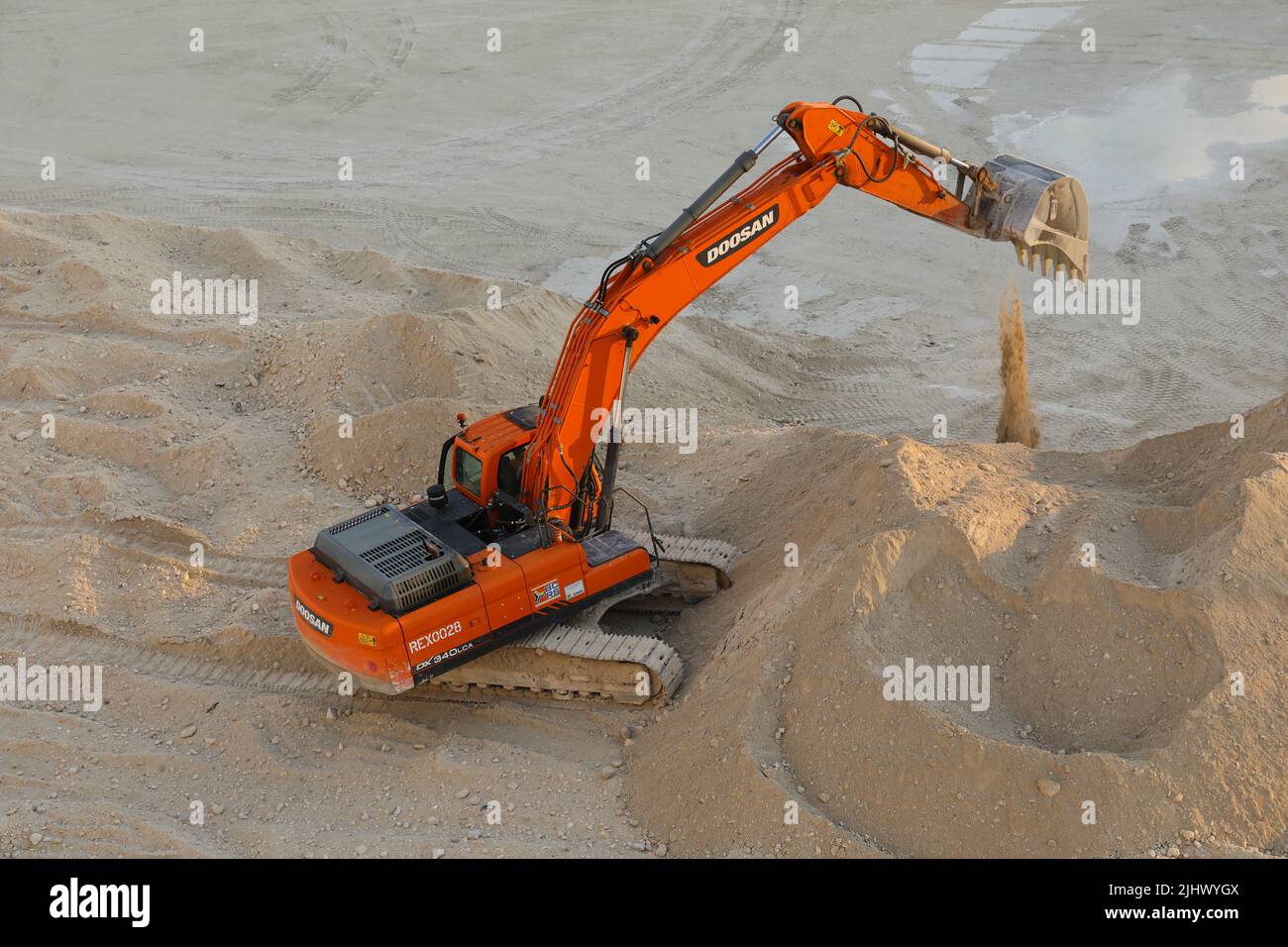 excavator machine at excavation earthmoving work in sand quarry Stock ...