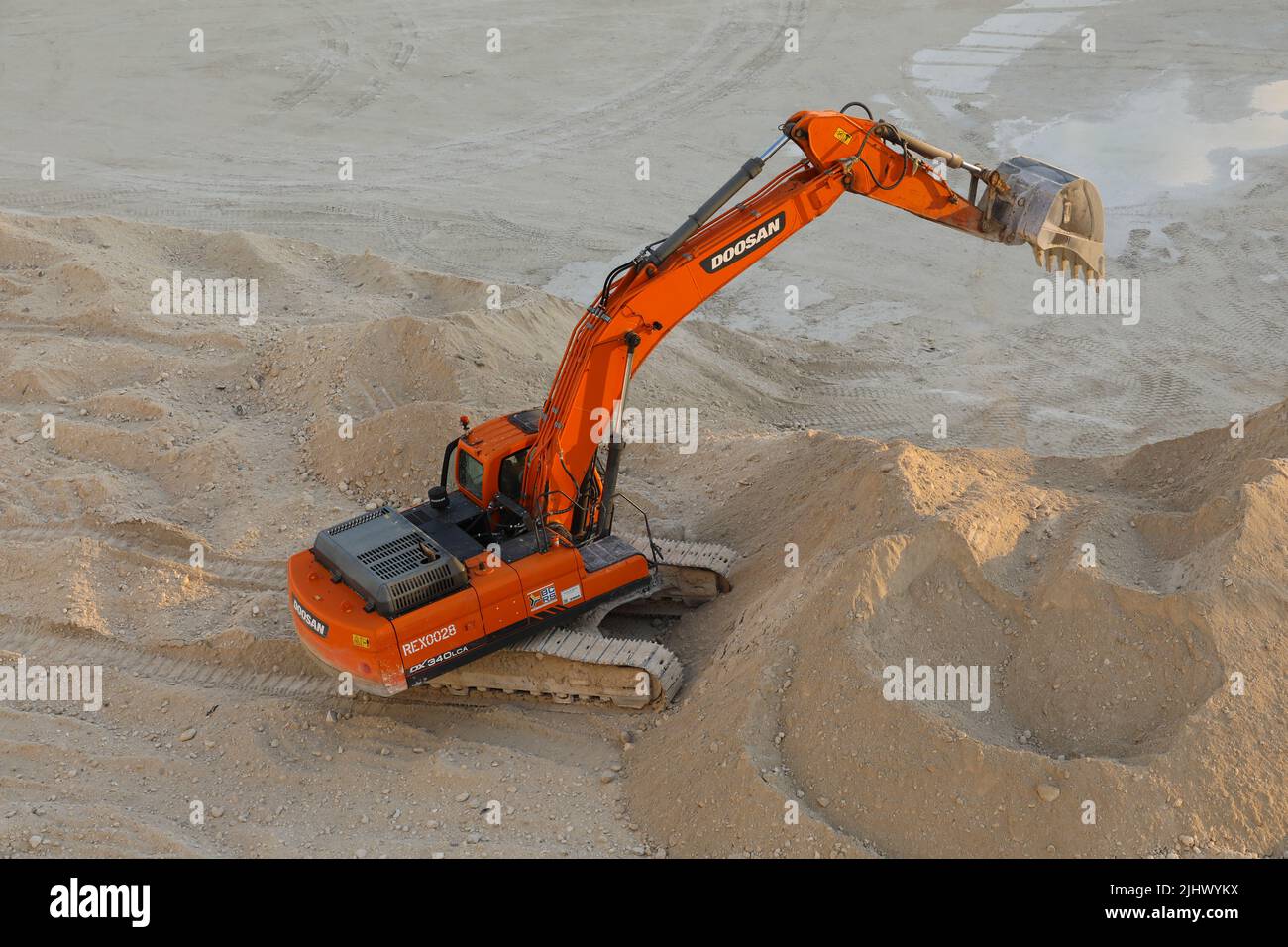 excavator machine at excavation earthmoving work in sand quarry Stock ...