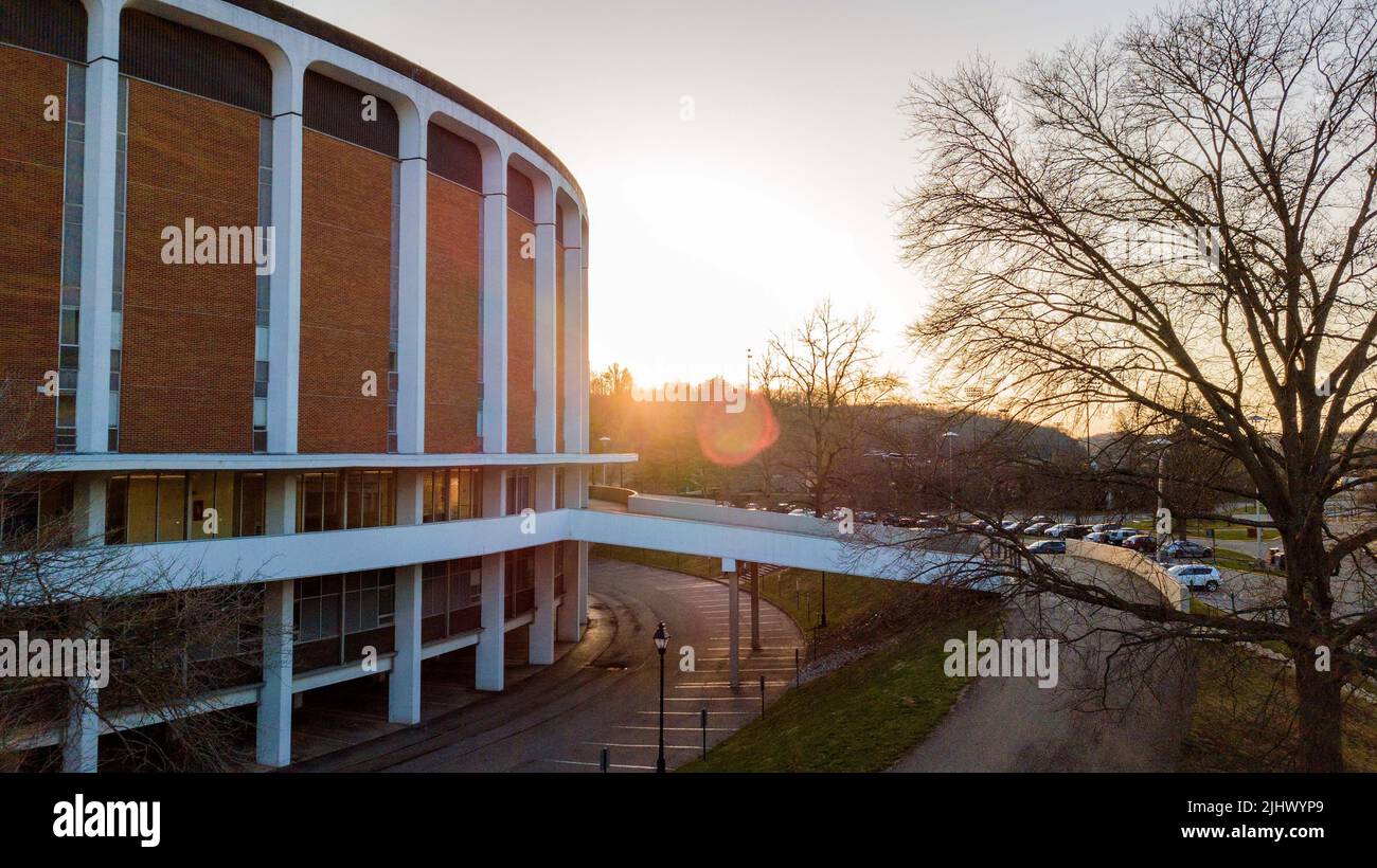 A round building with a parking lot at sunset Stock Photo - Alamy