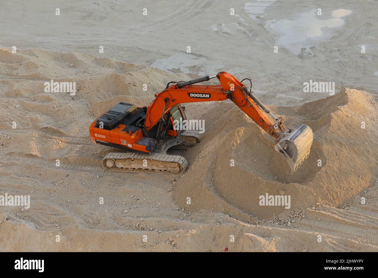 excavator machine at excavation earthmoving work in sand quarry Stock ...