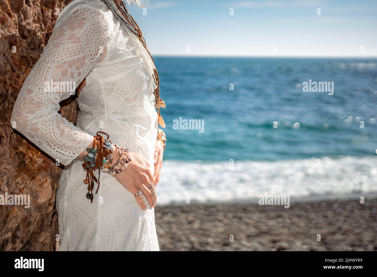 Woman in bohemian clothing on beach at sunset. Boho style for ...