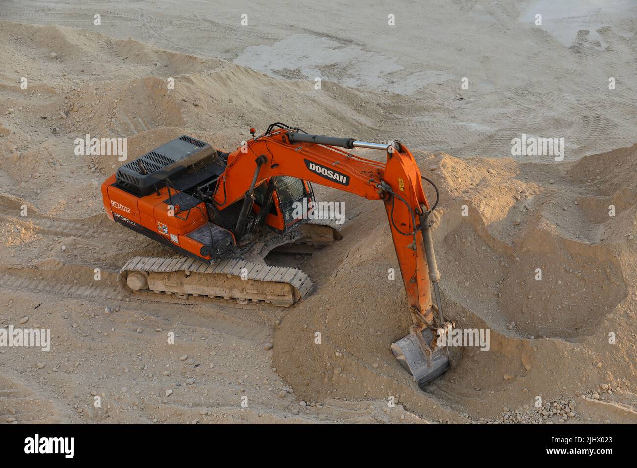 excavator machine at excavation earthmoving work in sand quarry Stock ...