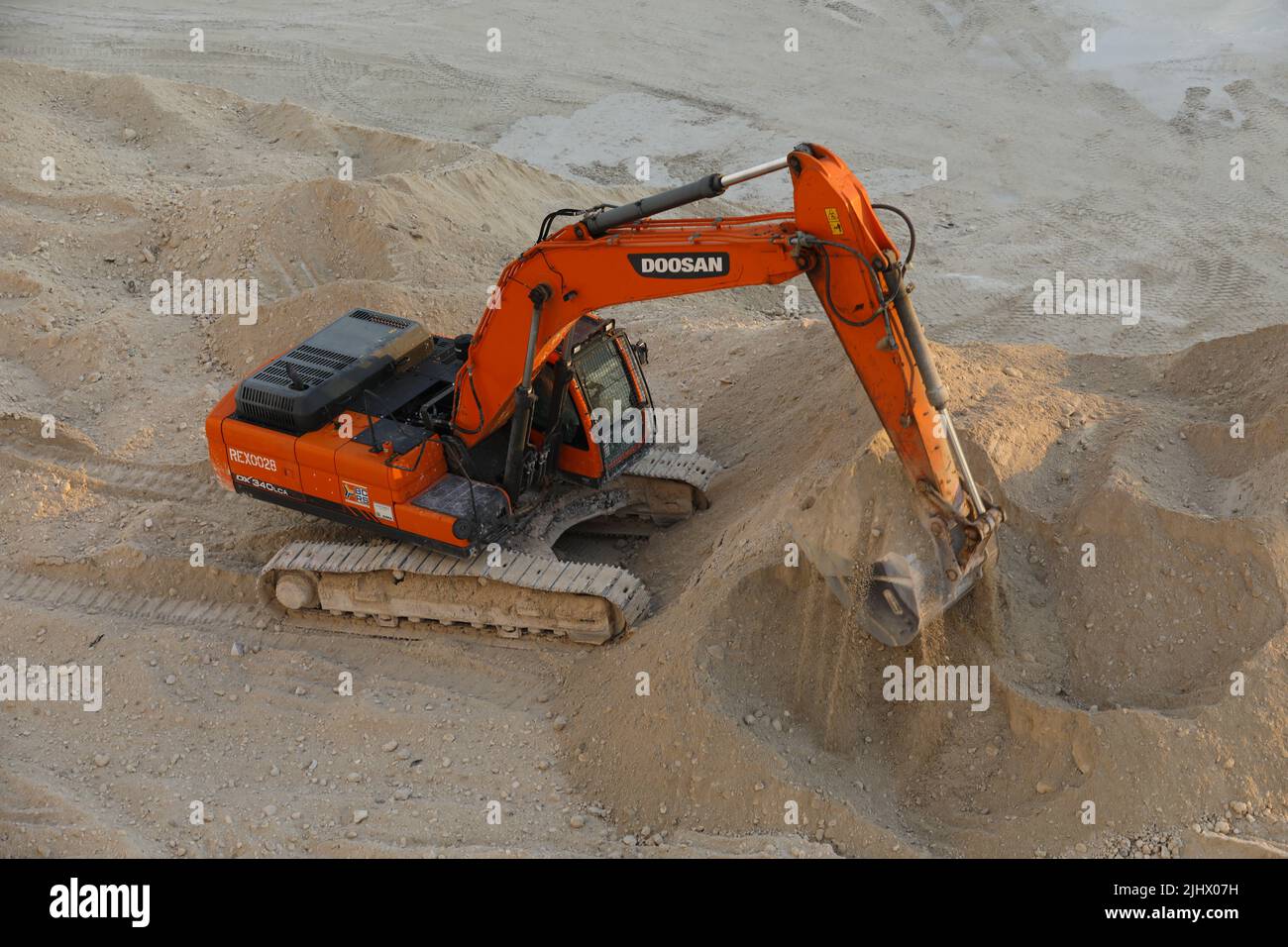 excavator machine at excavation earthmoving work in sand quarry Stock ...