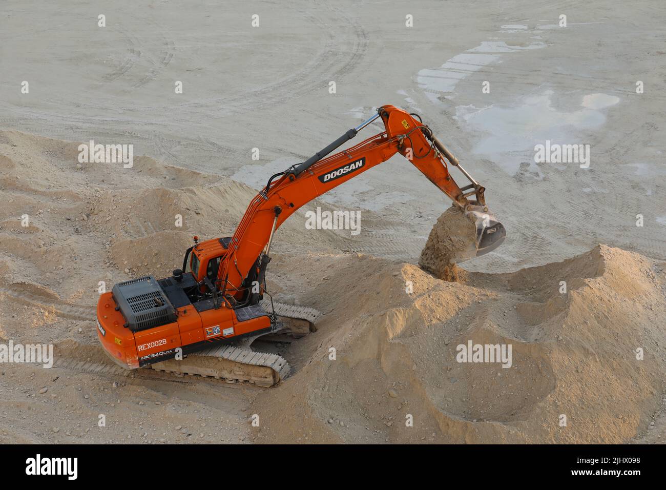 excavator machine at excavation earthmoving work in sand quarry Stock ...