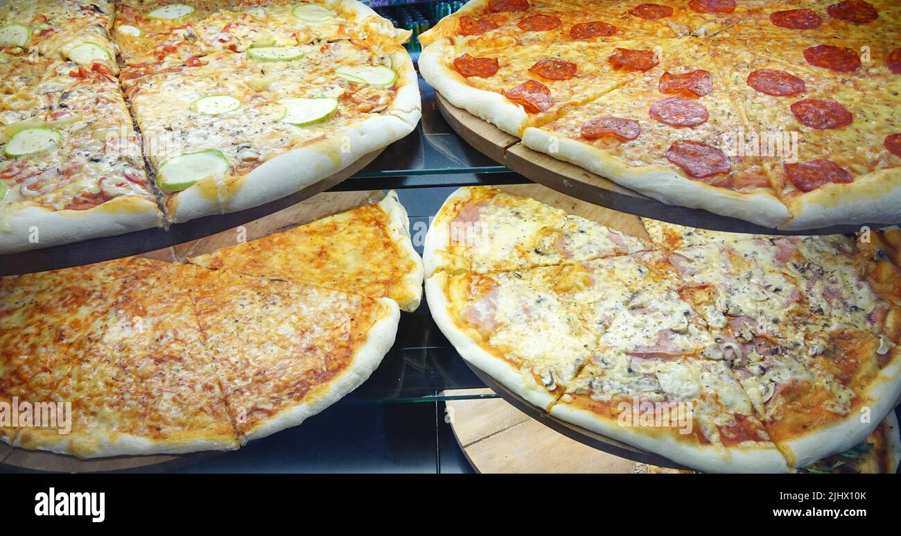 Fresh pizza on a counter Stock Photo - Alamy