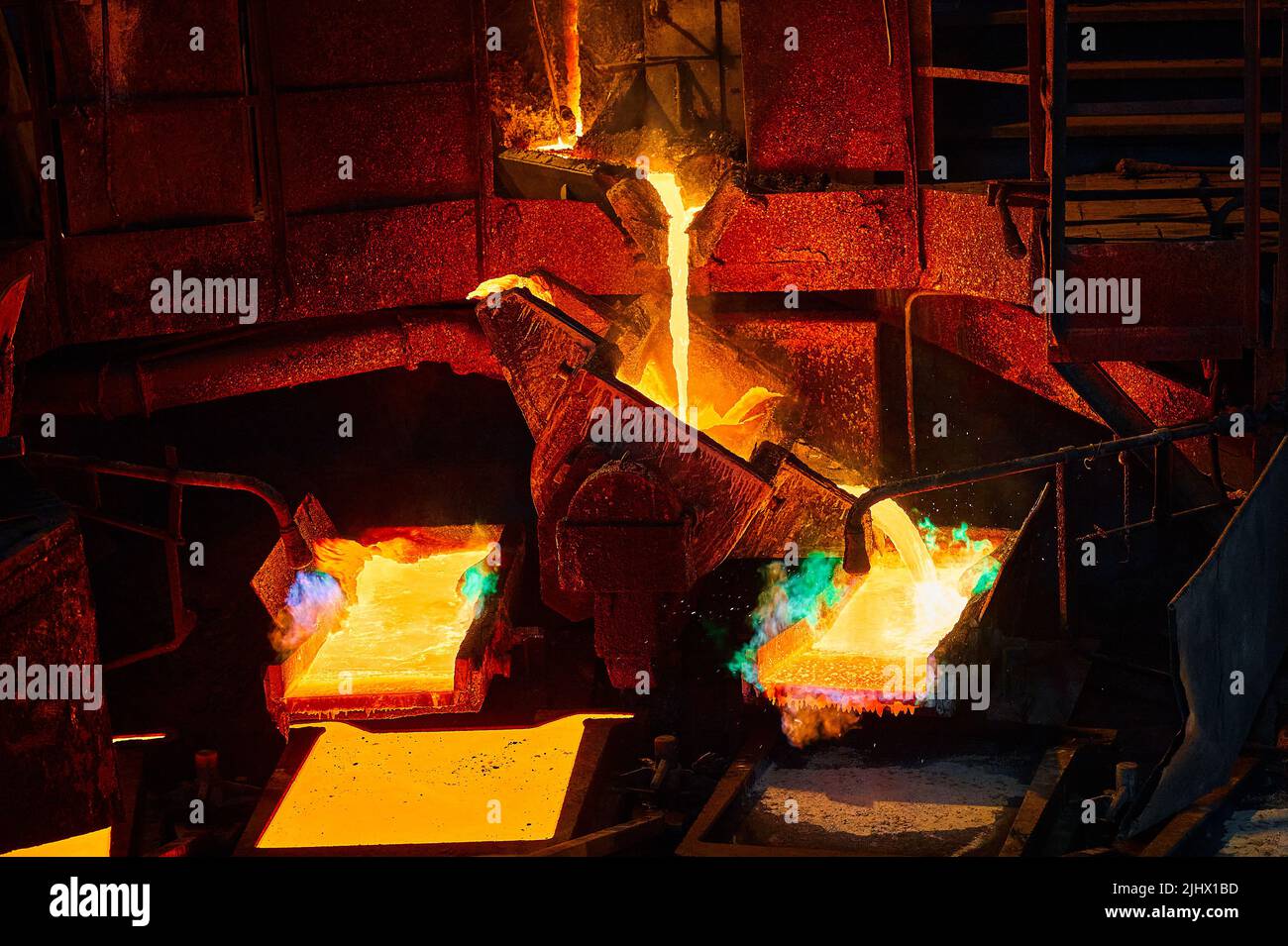 Pouring molten copper for anodes into form on casting wheel Stock Photo ...