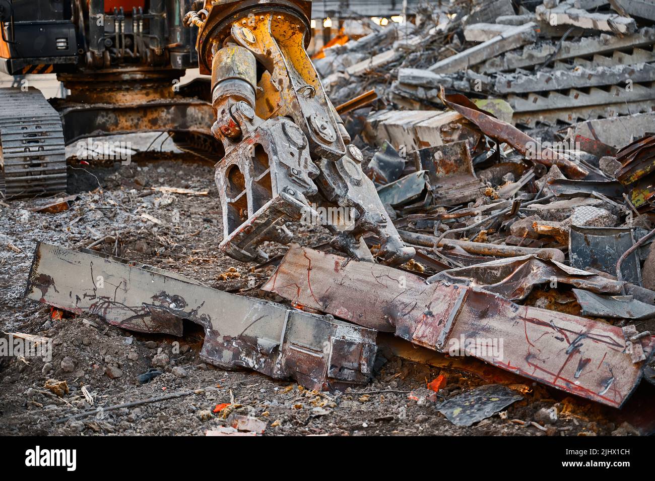 Hydraulic scissors cut steel beam for next recycling Stock Photo - Alamy
