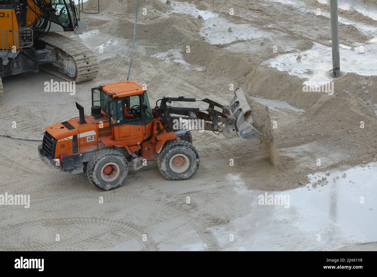 landscape photo of wheel loader in construction site Stock Photo - Alamy