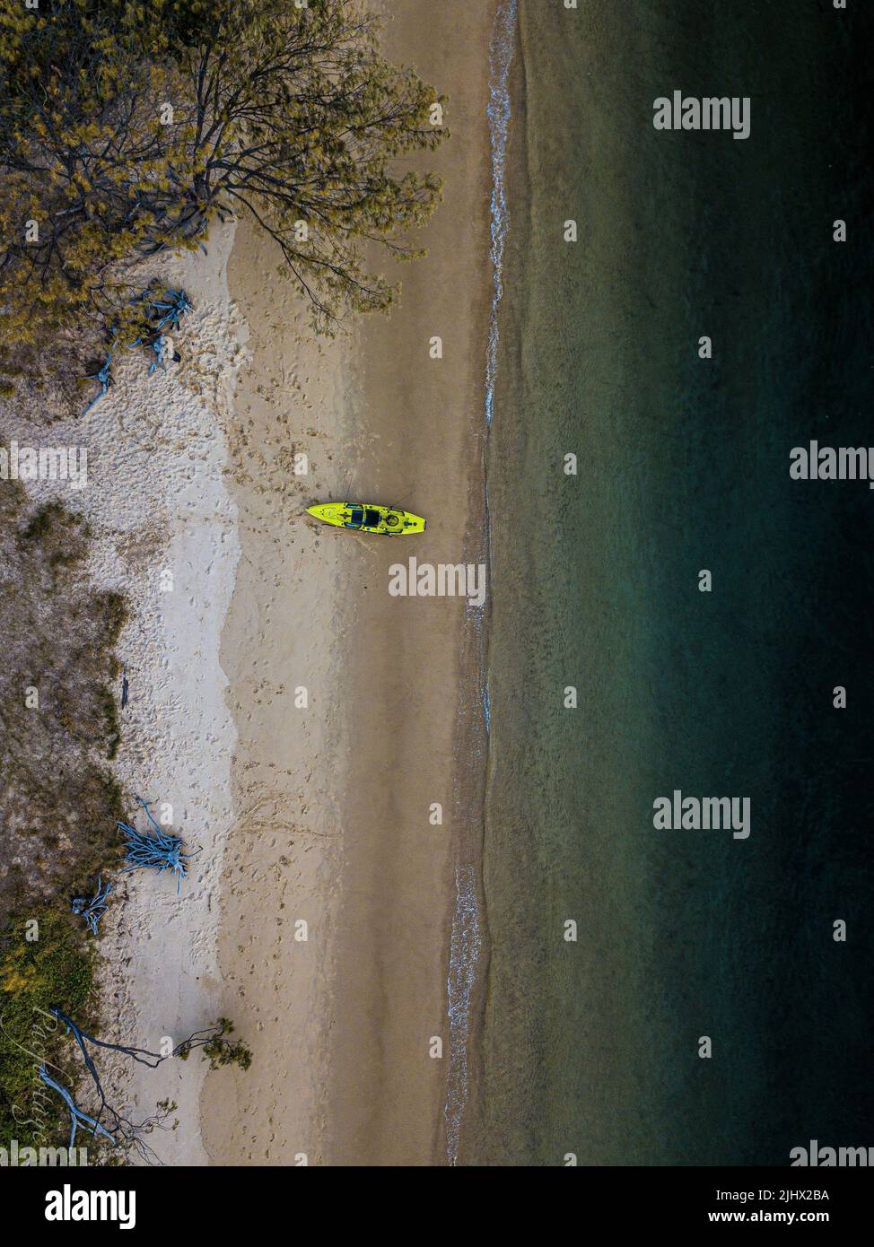 A top view of a yellow canoe on the beach in Gold coast, Australia ...