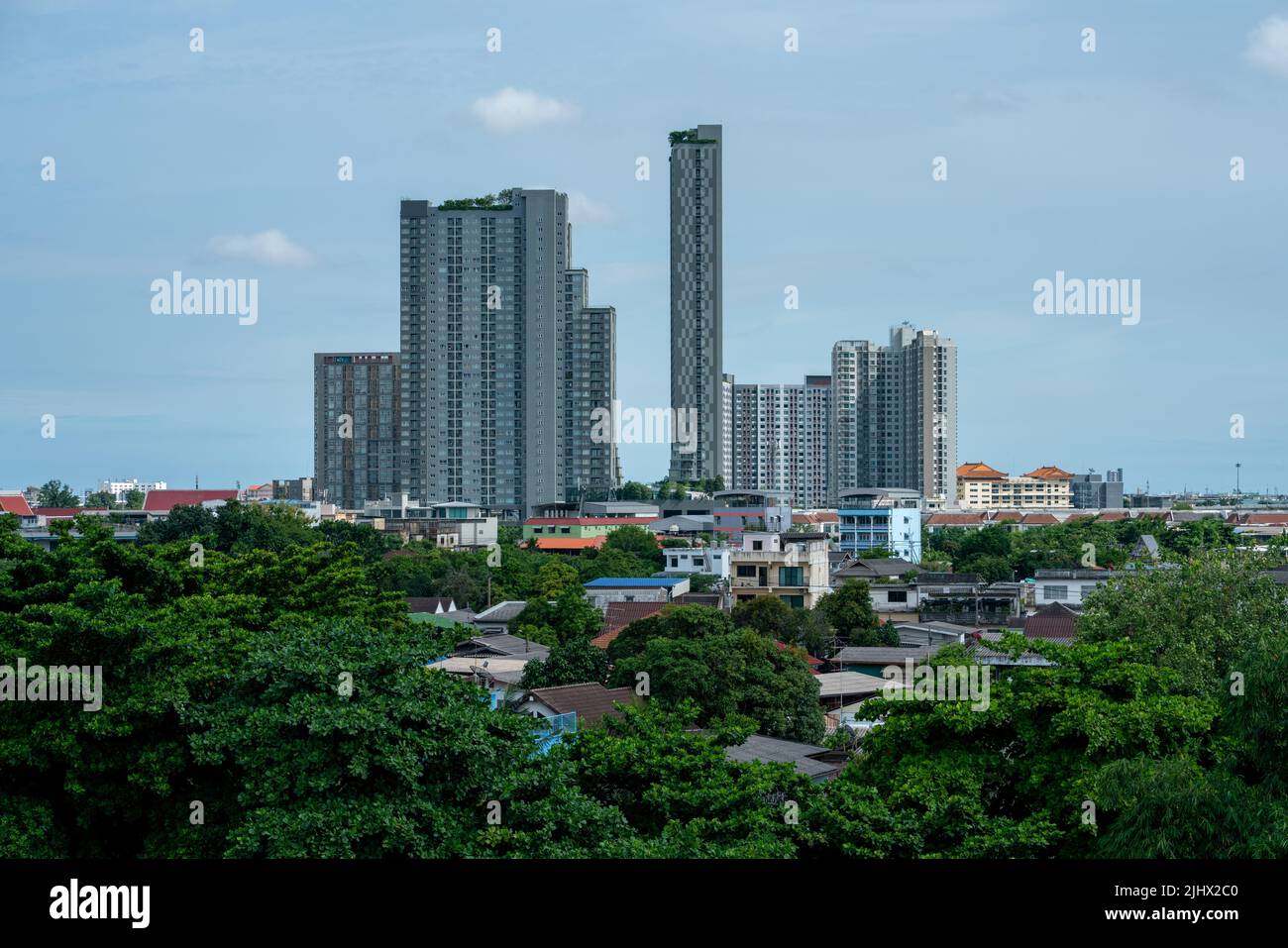 Mix of low and high rise building in the outskirts of Bangkok.. Green ...