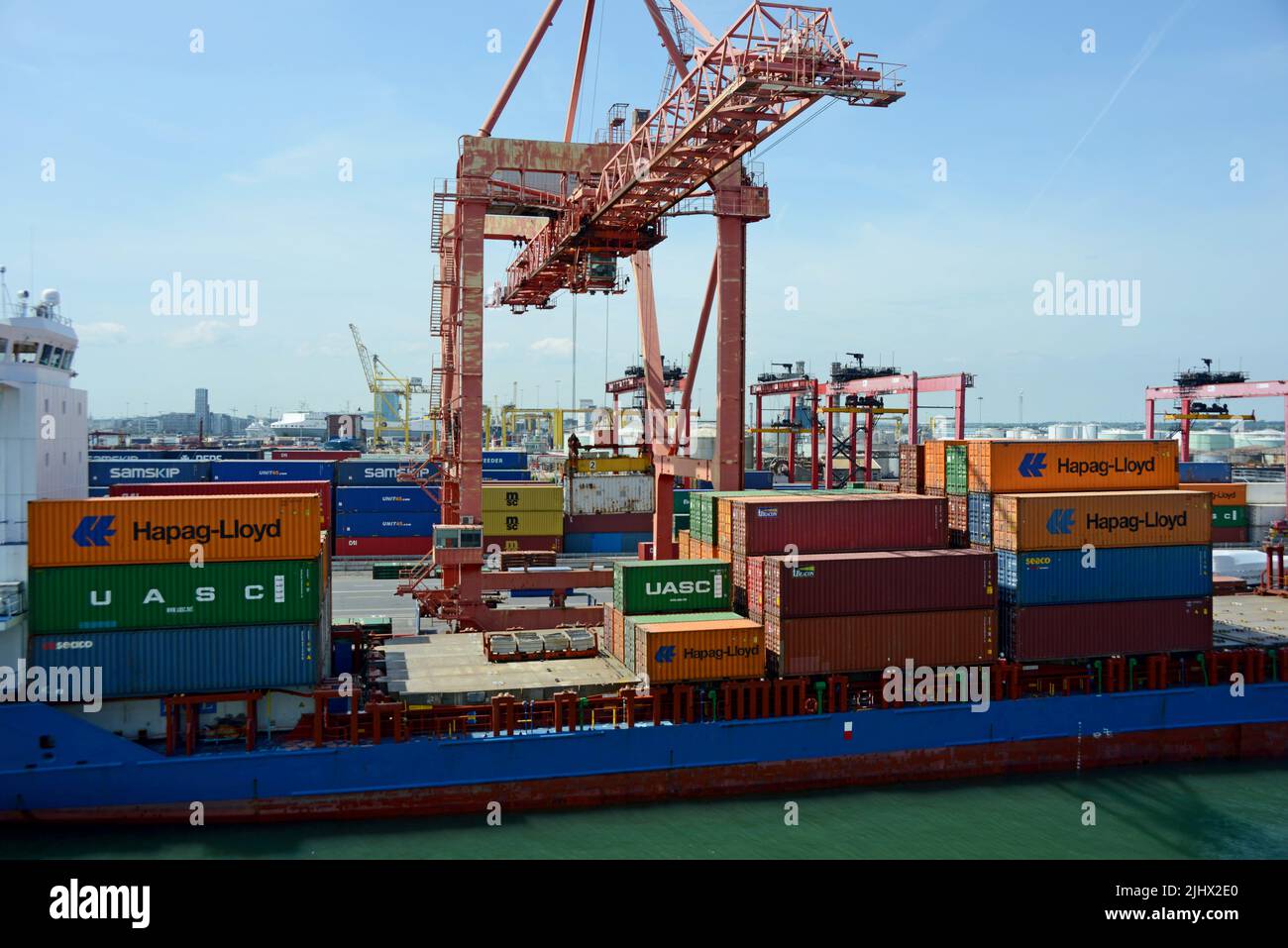 Harbour container crane unloading shipping containers from Container ship CT Pachua in Dublin ...