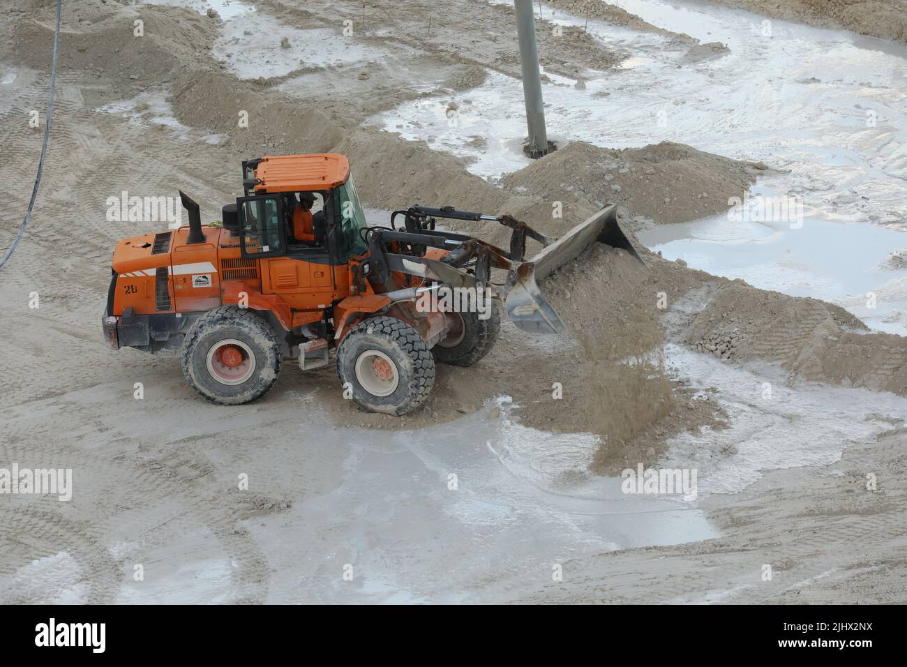 landscape photo of wheel loader in construction site Stock Photo - Alamy